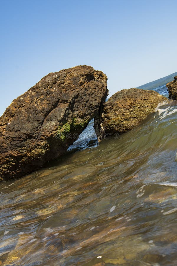 Rocky seashore and waves stock image. Image of dawn - 254146085