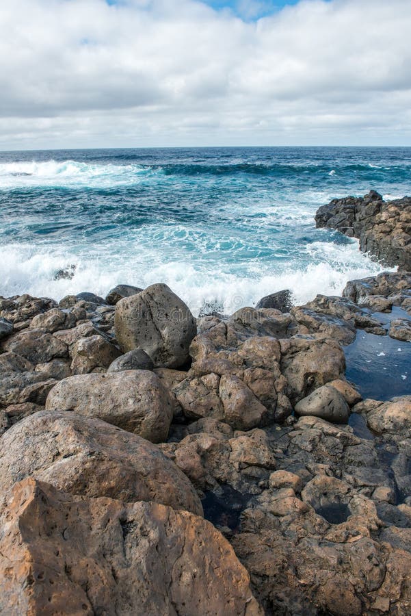 Rocky shore stock photo. Image of cloudy, rock, ocean - 56187820