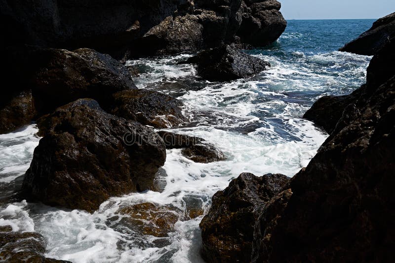 Rocky shore. Tidal bore stock image. Image of scenic - 218721409