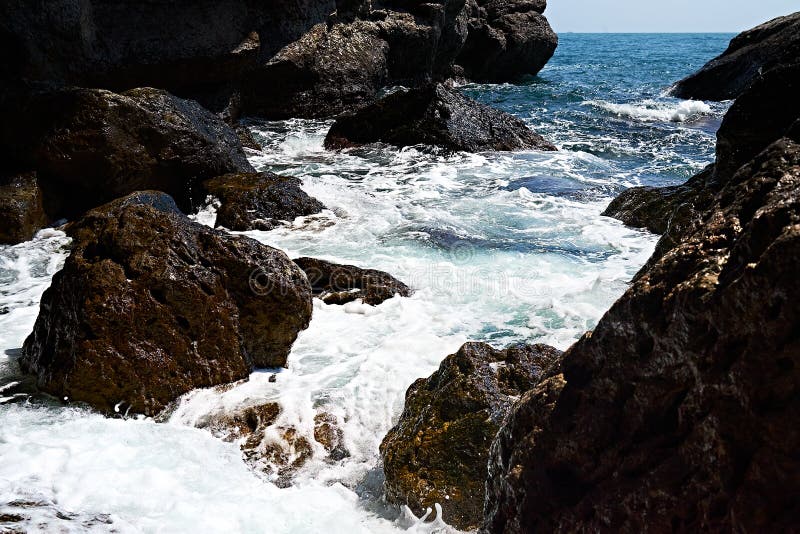 Rocky shore. Tidal bore stock image. Image of ocean - 230448555