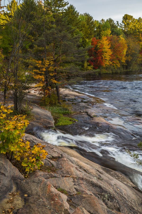Rocky Shoreline in Autumn stock photo. Image of summer - 60459394