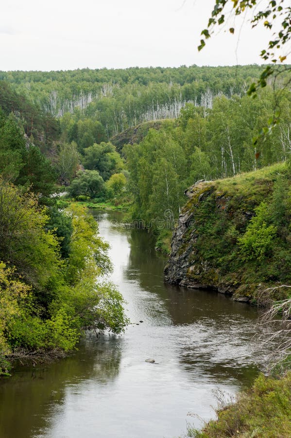 Rocky Shores of the River, Covered with Beautiful Trees Stock Image ...