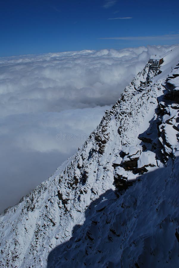 Rocky Snow Mountain and Cumulus Clouds Stock Image - Image of clouds ...