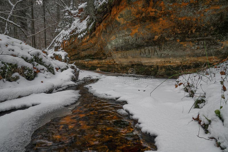 A Rocky Stream Flows Along the Sandstone Cliffs Stock Photo - Image of ...