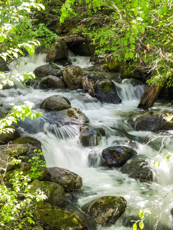 Rocky Stream with Bridge in Autumn Stock Photo - Image of rocks, water ...