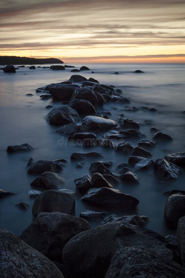 Rocky sunset stock image. Image of horizon, rocks, calm - 36241483