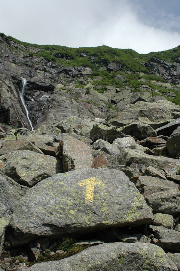 Rocky Trail with Yellow Arrow Stock Photo - Image of steep, peak: 1123070