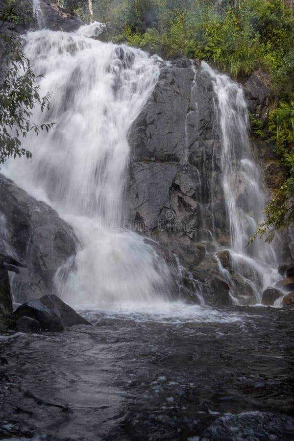 Rocky Waterfall in a Forest, Vertical Shot Stock Photo - Image of ...