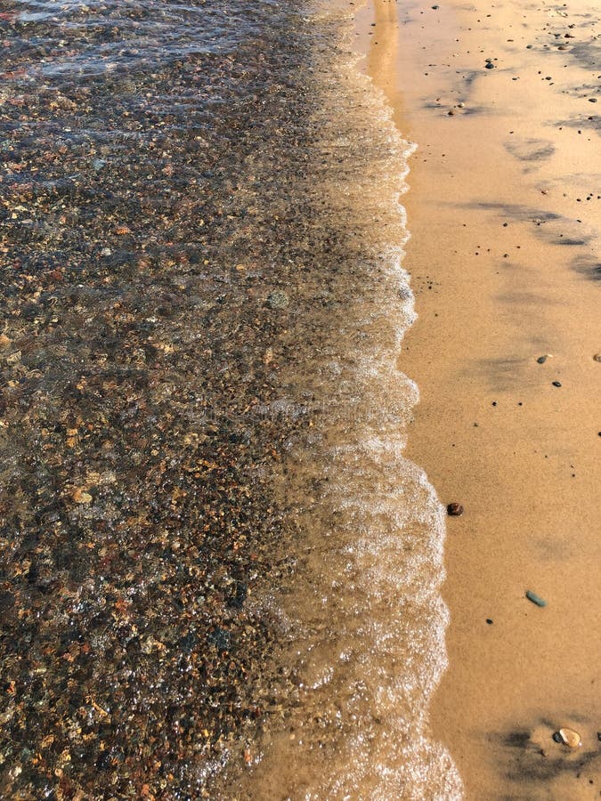 Rocky beach waves stock photo. Image of lake, waves - 327747536