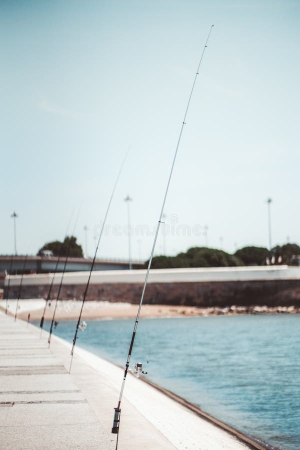 Rods on an Empty Waterfront Stock Photo - Image of pole, sidewalk ...