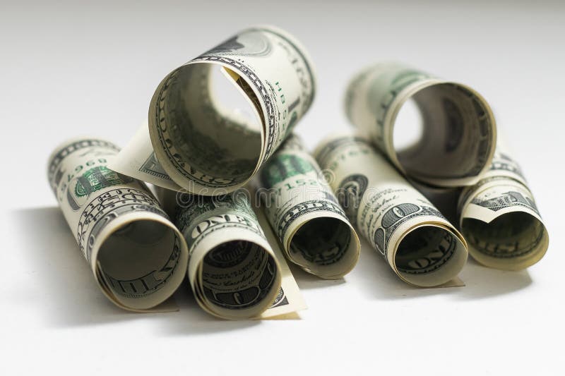 A Role-dollar Bills in Front of White Background Stock Photo - Image of ...