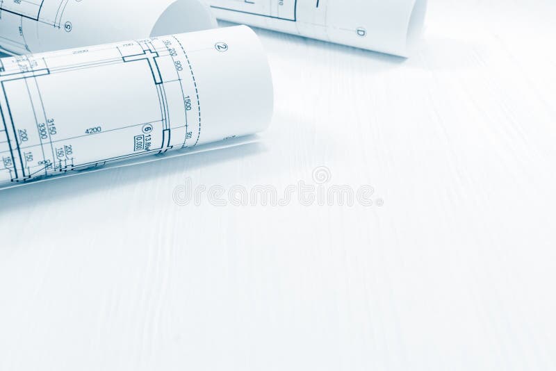 Roll of Architectural Blueprints and Engineering Drawings on White ...