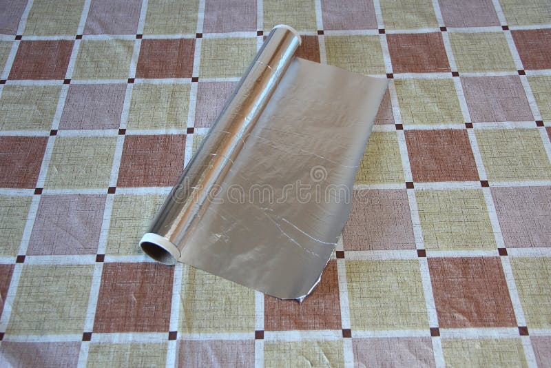 Roll of Baking Foil on a Table Stock Photo - Image of material ...