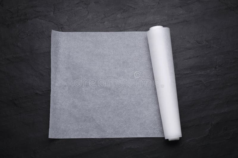 Roll of Baking Paper on Black Table, Top View Stock Photo - Image of ...