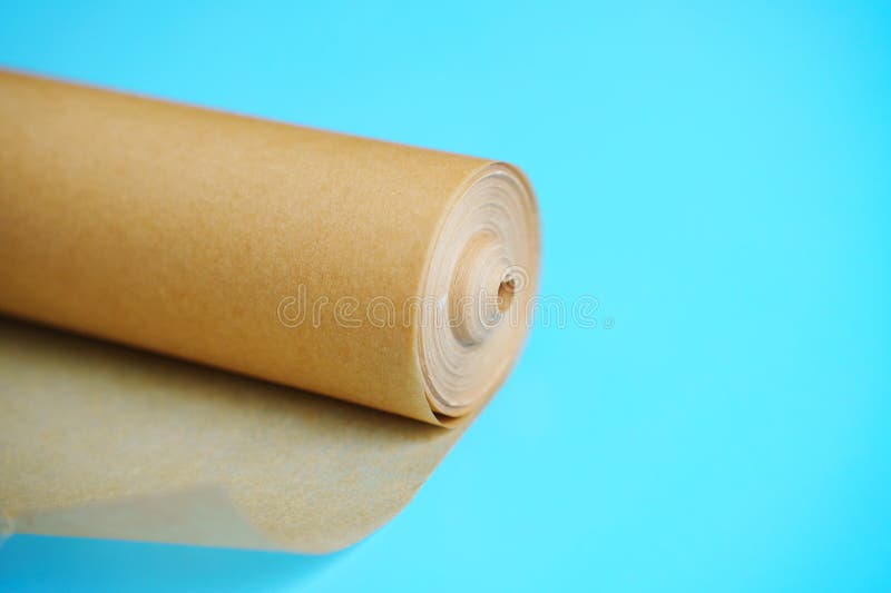 A Roll of Baking Paper on a Blue Background. Stock Image - Image of ...