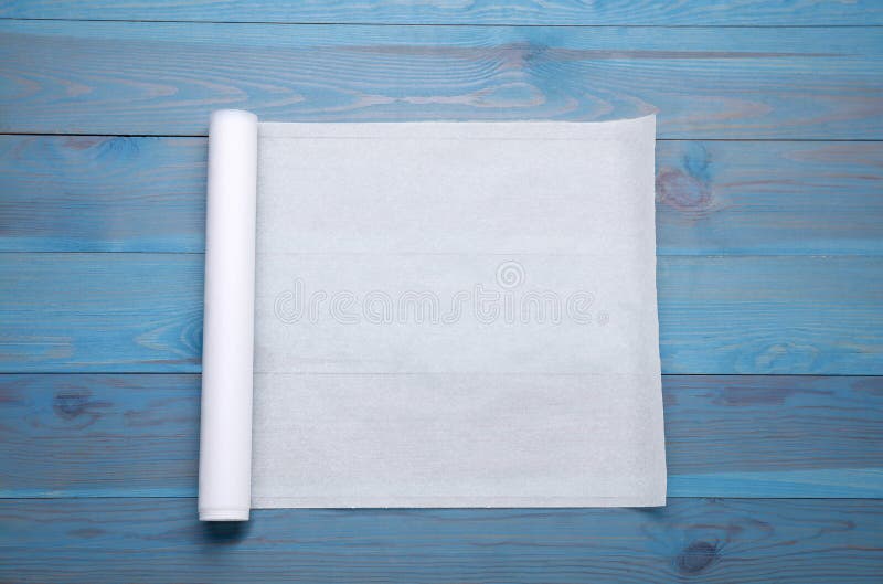 Roll of Baking Paper on Light Blue Wooden Table, Top View Stock Photo ...