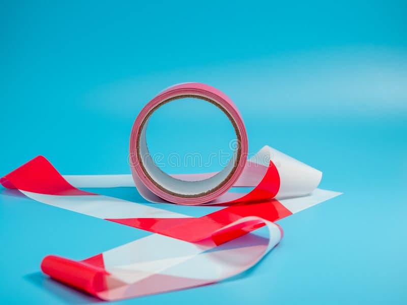 Roll of Barrier Tape on a Blue Background. Stock Photo - Image of ...