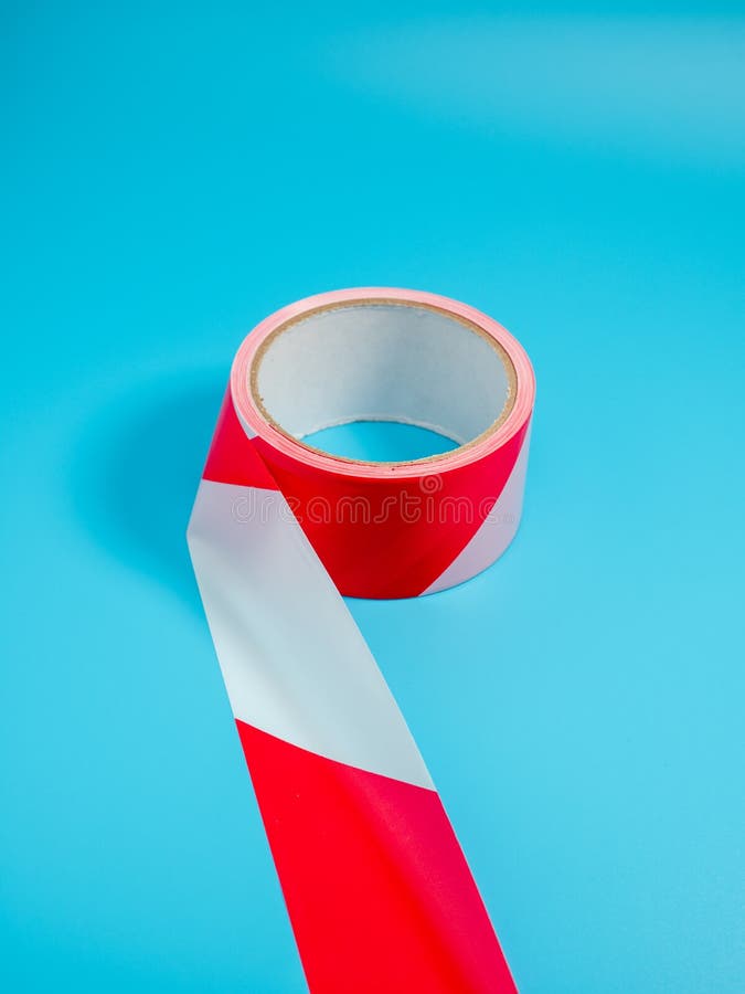 Roll of Barrier Tape on a Blue Background. Stock Photo - Image of ...