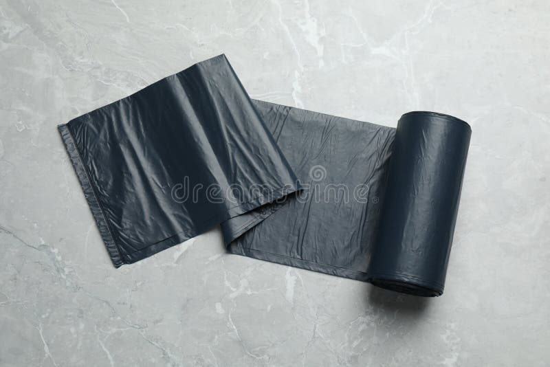Roll of Black Garbage Bags on Light Grey Marble Table, Top View Stock ...