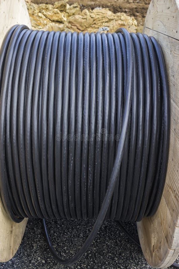 Roll of Black Industrial Cable on Large Wooden Reel Stock Photo - Image ...