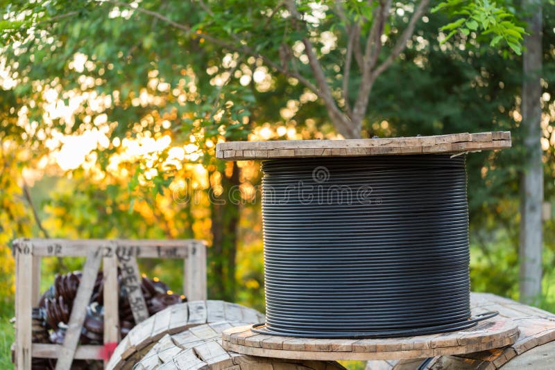 Roll of Black Industrial Underground Cable on Large Wooden Reel Stock ...