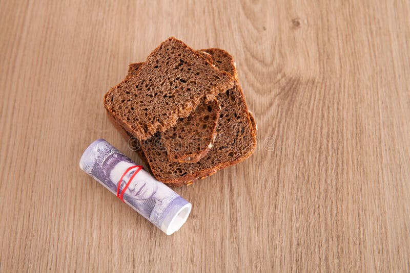 A Roll of British Pound Banknotes and Black Bread Editorial Photo ...