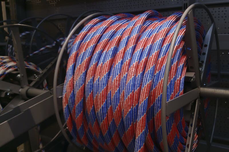 A Roll of Colored Rope on a Metal Holder. Twine Coil for Lifting Heavy ...