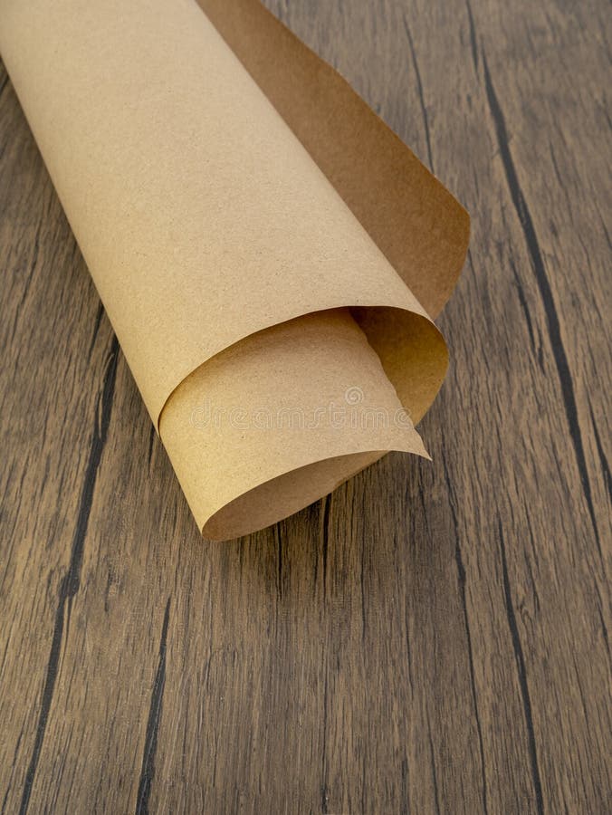 A Roll of Craft Paper on a Wooden Background Stock Image - Image of ...
