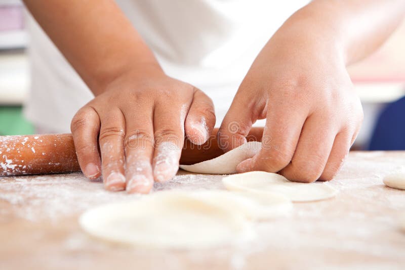 Roll Dumpling Skins To Make Dumplings Stock Photo - Image of hand ...