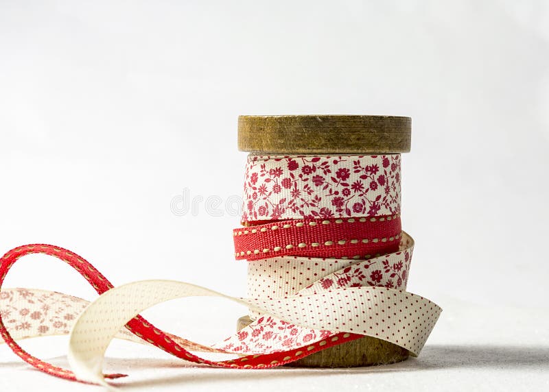 Roll of Three Christmas Ribbons on a Wooden Bobbin Stock Photo - Image ...