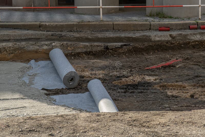 A Roll of Geotextile is Laid on Road Construction. Layer of Modern Road ...