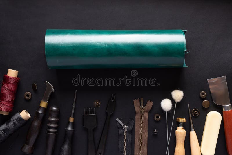 Roll of Green Leather and Various Tools for Handcrafting Leather ...