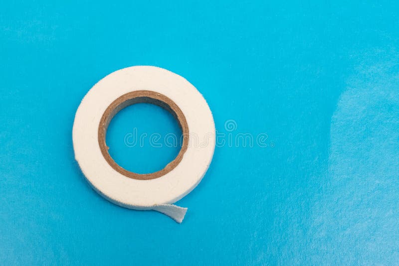 Roll of Medical Adhesive Plaster on Blue Background Stock Photo - Image ...