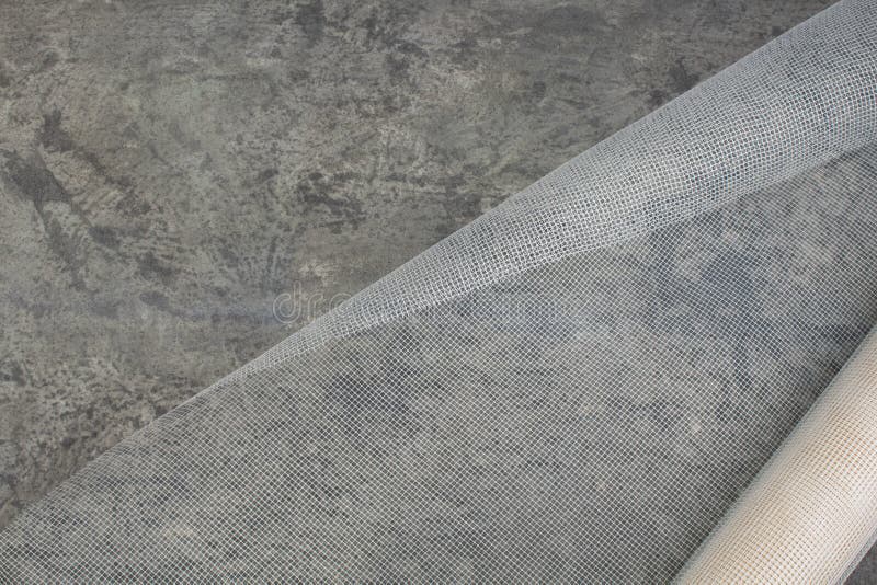 Roll Mesh for Plastering on the Gray Concrete Background. Copy Space ...