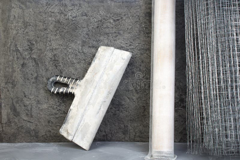 Roll Mesh for Plastering, Putty Knife on the Gray Concrete Background ...