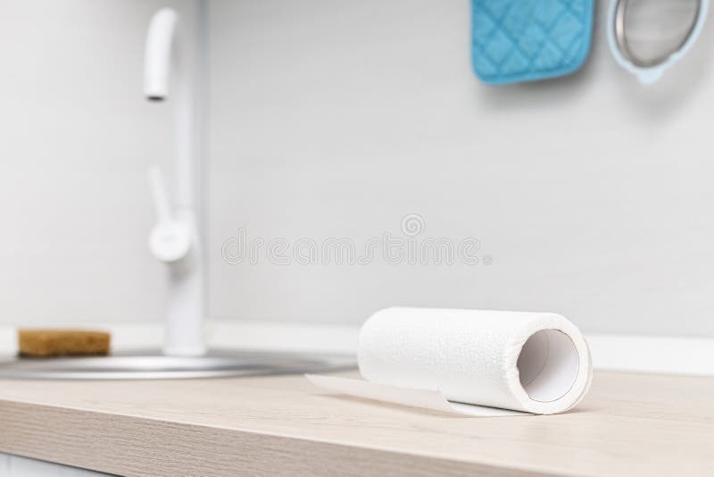 A Roll of Paper Towel Lies on the Kitchen Counter Stock Photo - Image ...