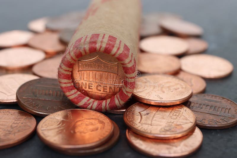 Roll of Pennies on Top of Loose Pennies. Stock Photo - Image of loose ...