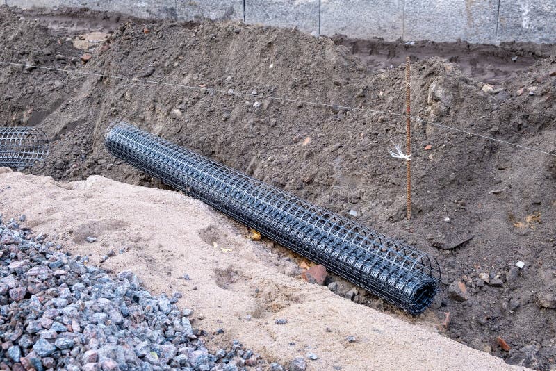 A Roll of Plastic Industrial Mesh Lies on the Ground Stock Image ...