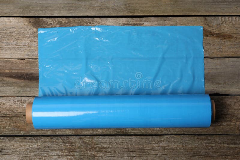 Roll of Plastic Stretch Wrap Film on Wooden Table, Top View Stock Image ...