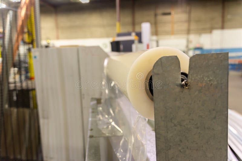Roll of Plastic Wrapping Material in Factory Workshop Packaging Stock ...