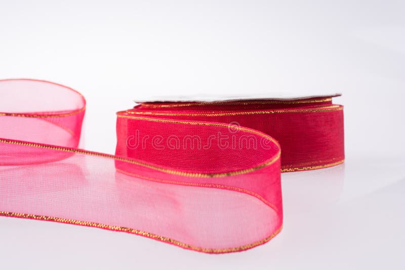 A roll of red ribbon stock image. Image of supply, ribbon - 145176009