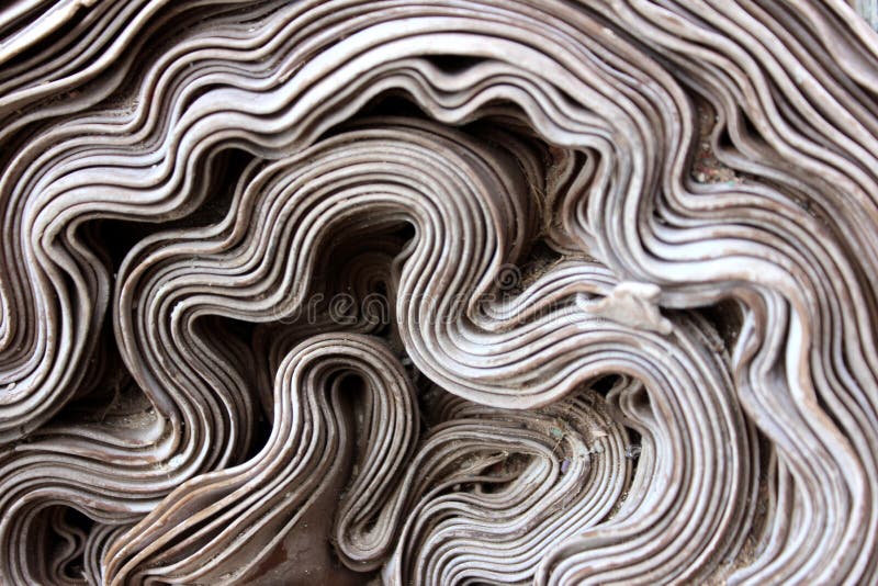 Roll of Rubber Cloth. Wavy Roll of Old Raw Rubber Stock Image - Image ...