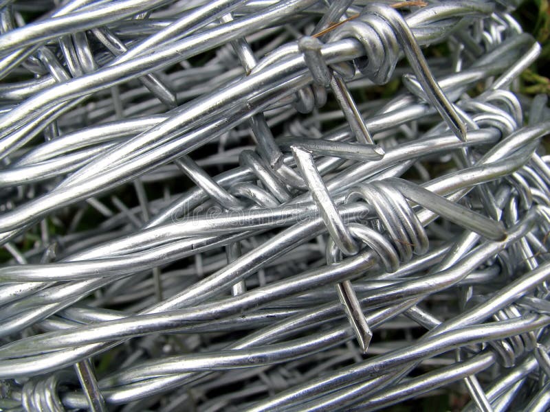 Roll of Steel Barbed Wire stock photo. Image of fortify - 9933432