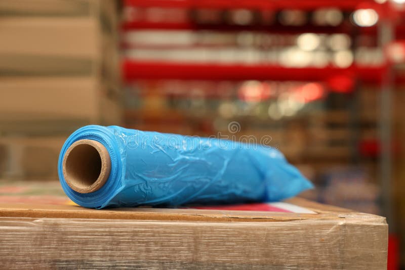 Roll of Stretch Wrap on Box in Warehouse Stock Image - Image of market ...