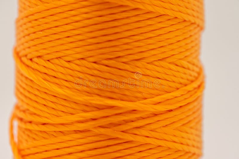 A Roll of Synthetic Orange Thread Stock Image - Image of yellow ...