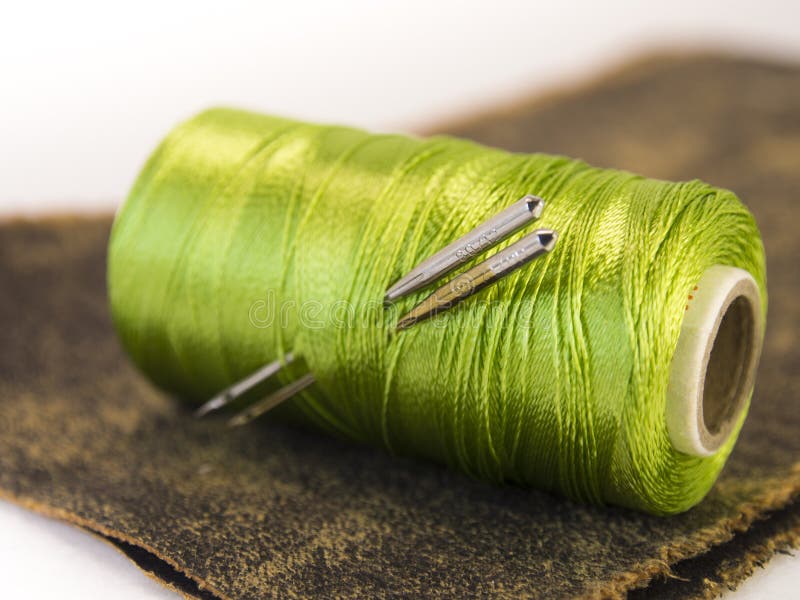 Colorful Roll Of Thread On A Piece Of Leather With A Needle. Stock ...
