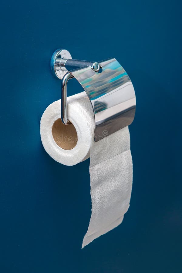 A Roll of Tissue Paper Hung on the Blue Wall Stock Image - Image of ...