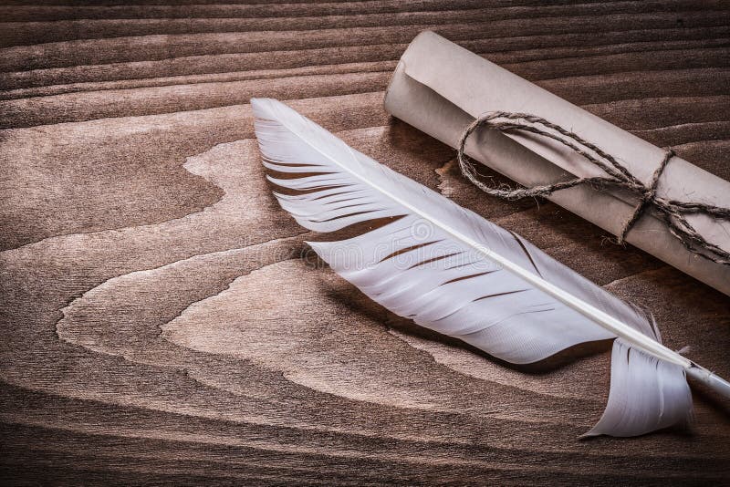 Roll of Vintage Paper Feather on Wooden Board Stock Image - Image of ...