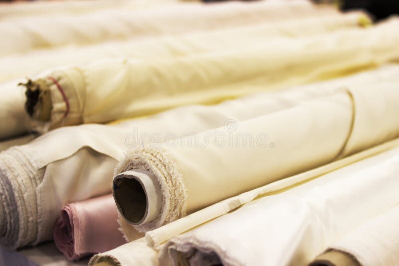 Roll of White Fabric for Cutting. Rolls of Light Fabric Stock Photo ...