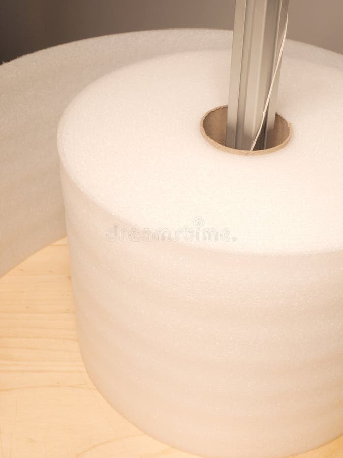 Roll of White Industrial Packaging Foam on a Reel Dispenser Stock Photo ...